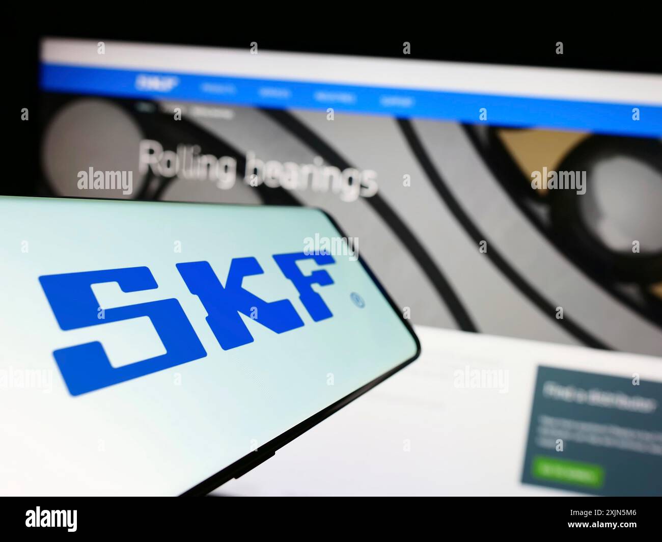 Stuttgart, Germany, 04-28-2023: Smartphone with logo of Swedish bearing manufacturing company ...