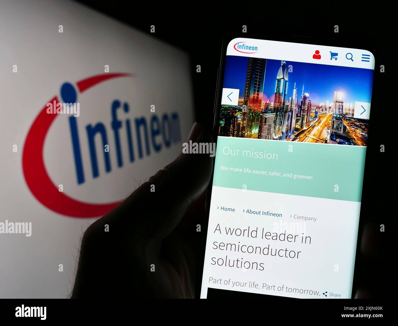 Stuttgart, Germany, 04-16-2023: Person holding smartphone with webpage of semiconductor company ...