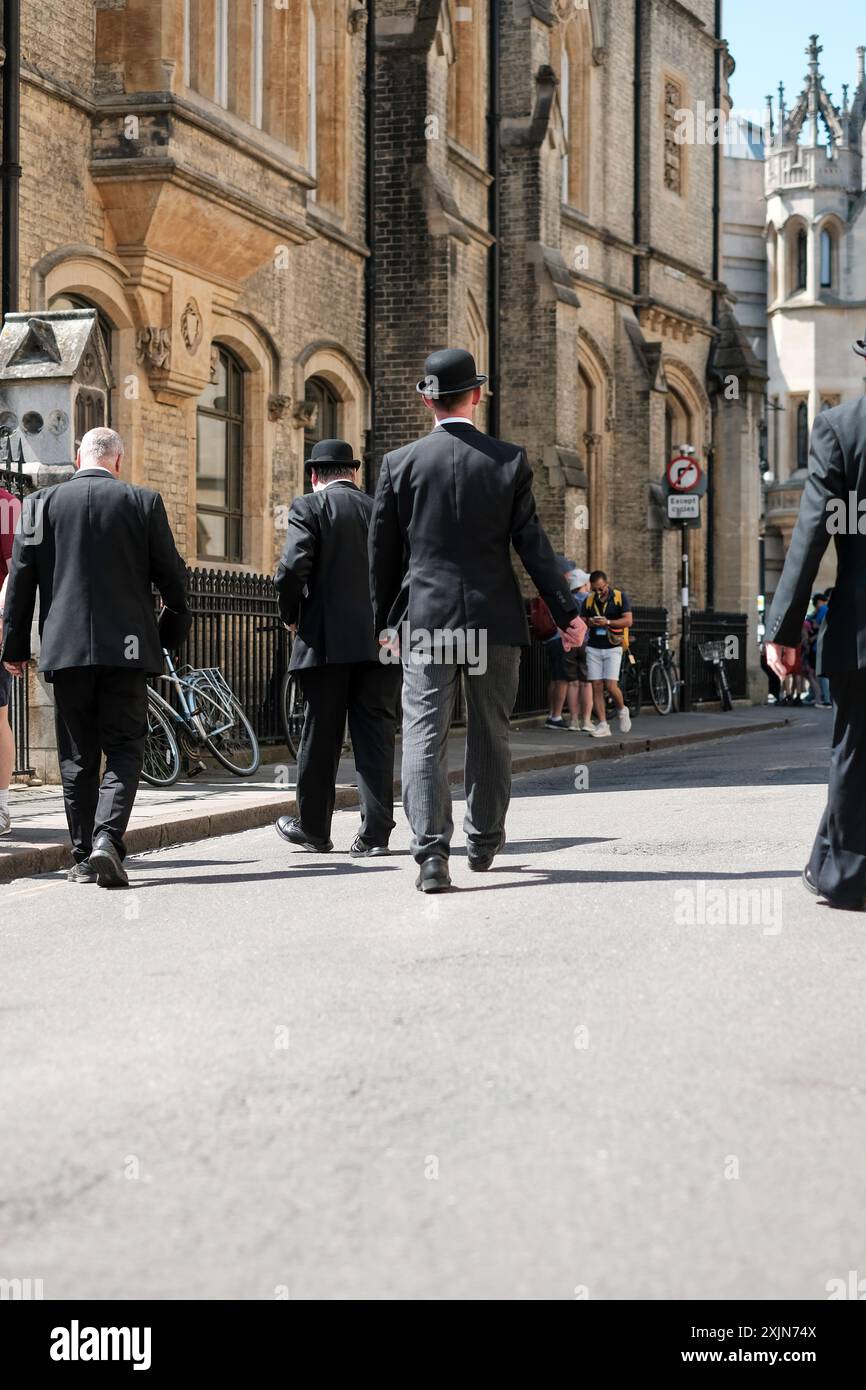 Staff at Cambridge University in traditional Bowler Hat and suit ...
