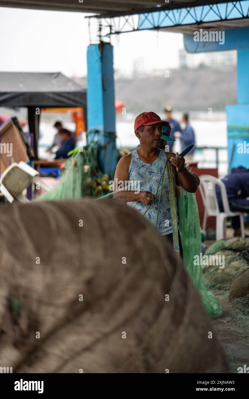 Lima - Peru, May 21, 2023 - The fishing port of Lima is a vibrant scene ...