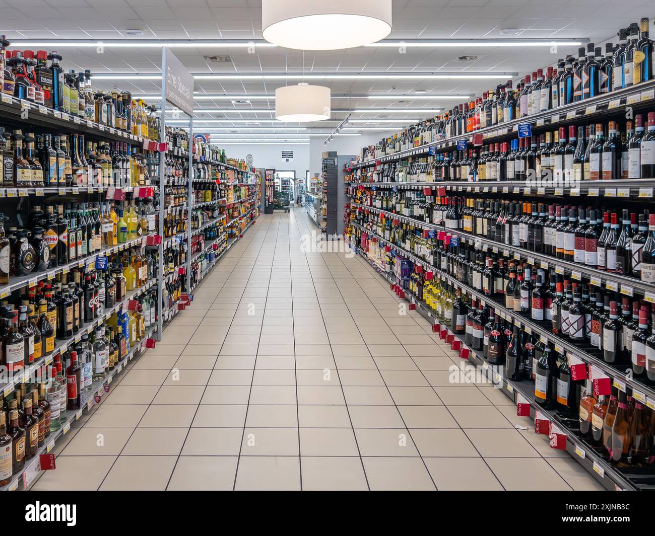 Italy - June 19, 2024: Wine and liquor aisle with shelves with Bottles ...