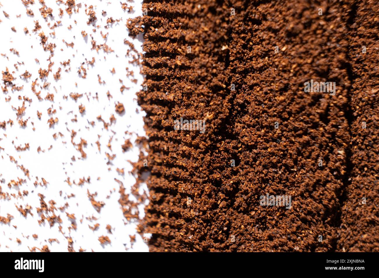 Scattered ground natural coffee on white background Stock Photo - Alamy