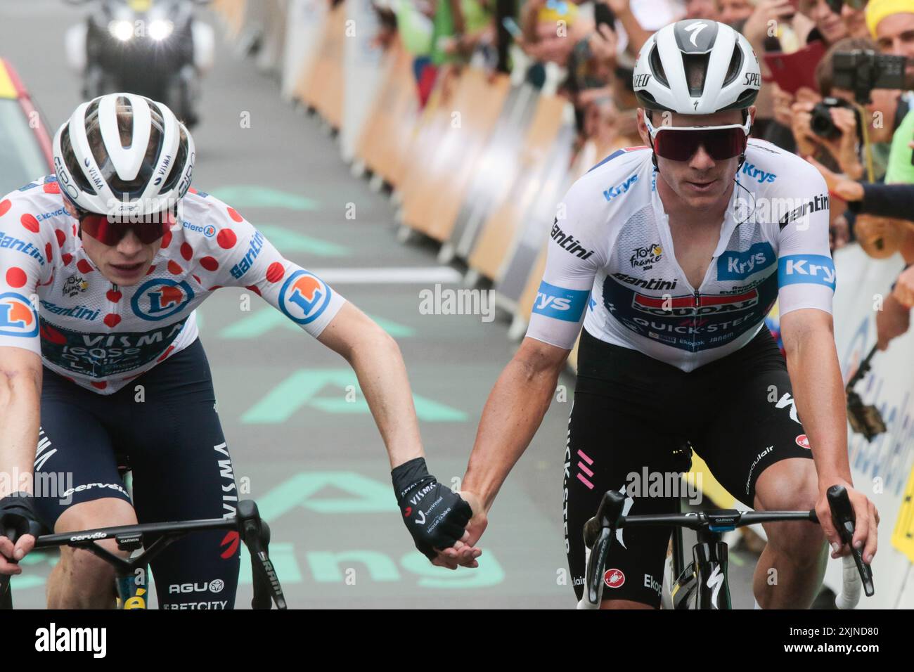 Remco Evenepoel and Jonas Vingegaard finish together in 2nd and 3rd overall; at the finish in ...