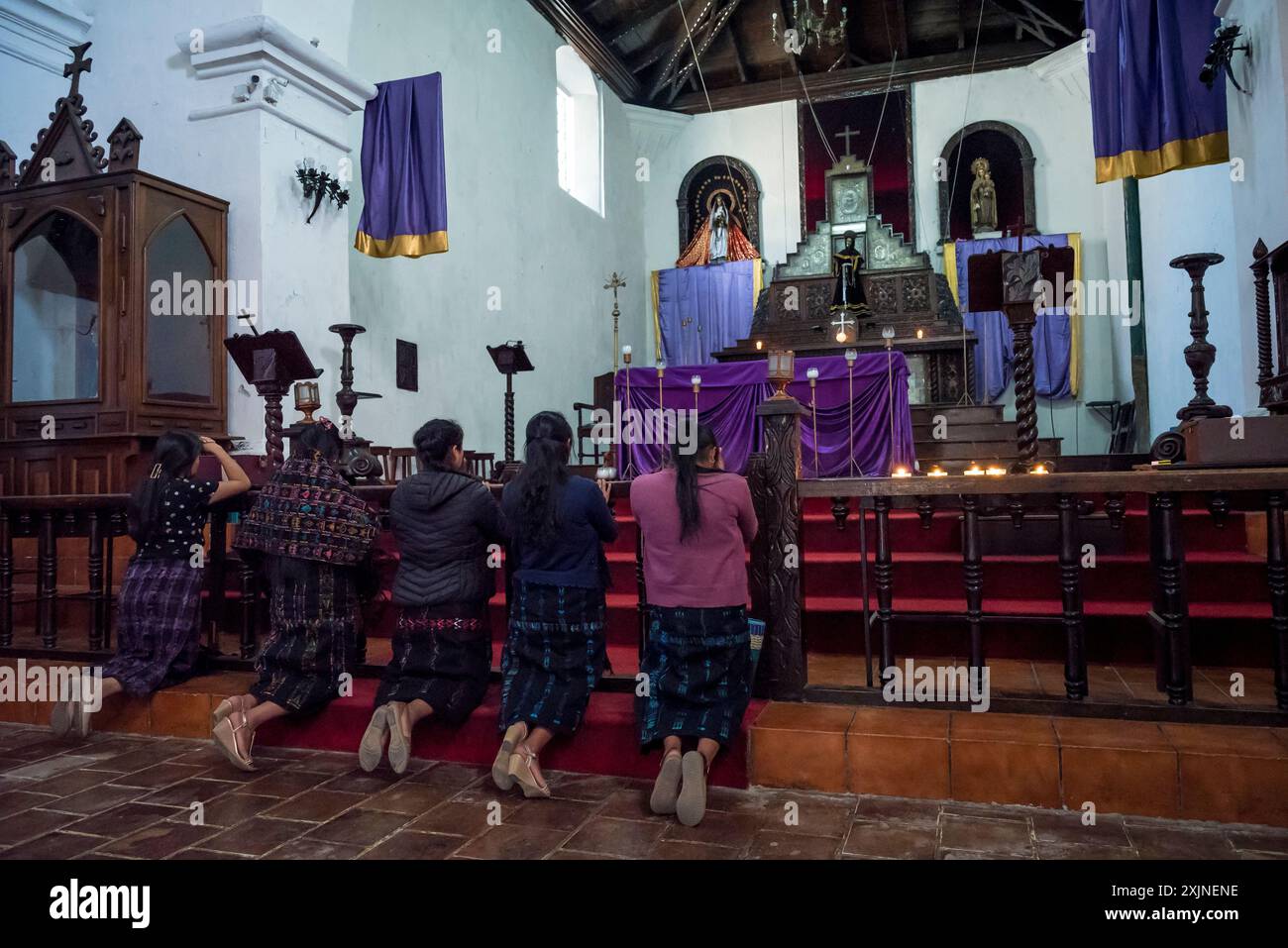 Mayan people praying on their knees in the Catholic Church, Panajachel ...