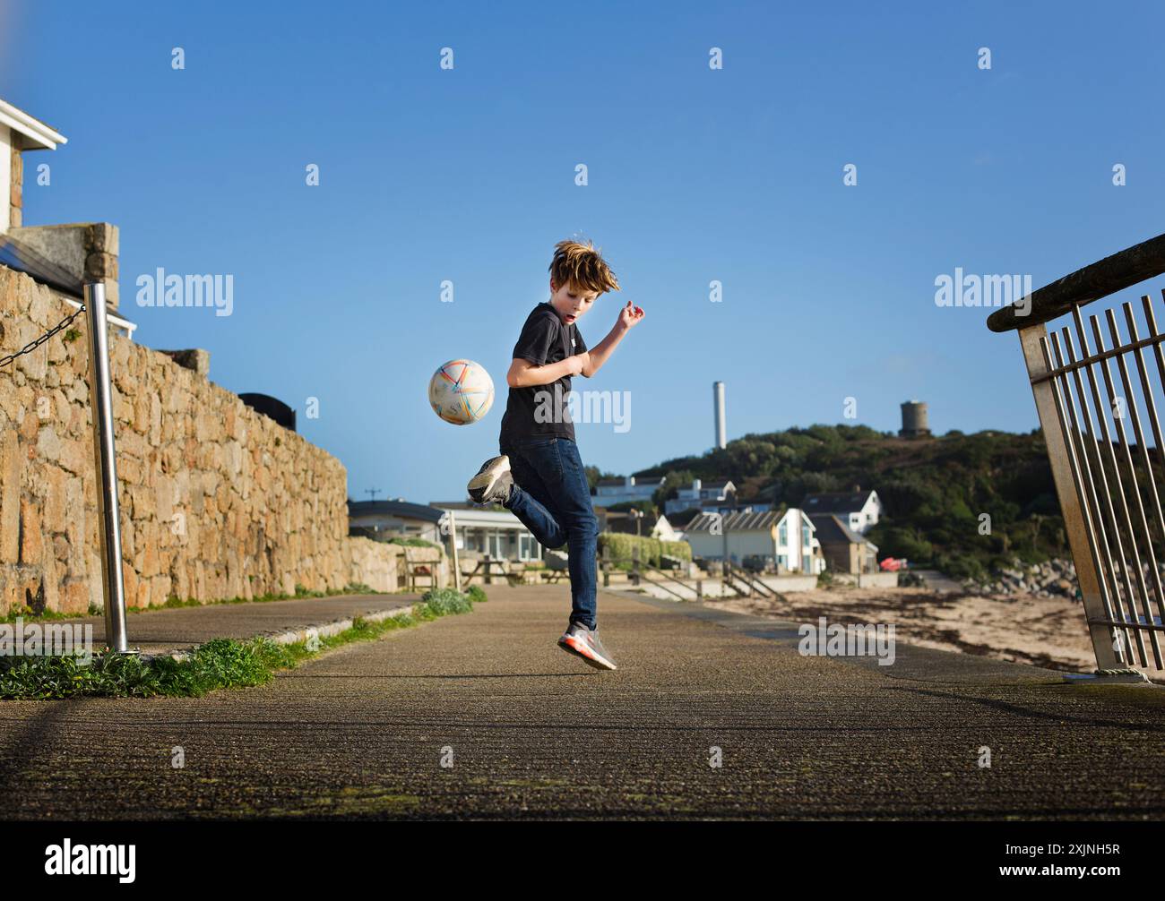 School boy practicing his football skills Stock Photo - Alamy