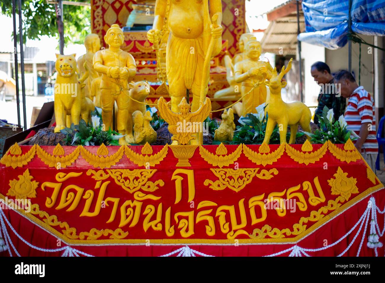 Thai Villagers decorate the candle procession for the Candle Parade to ...