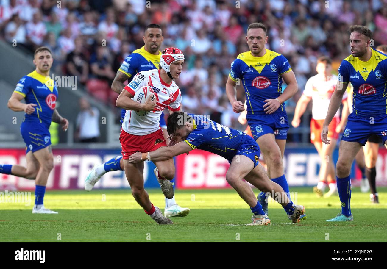 St Helens' Harry Robertson tackled by Warrington Wolves' Adam Holroyd ...
