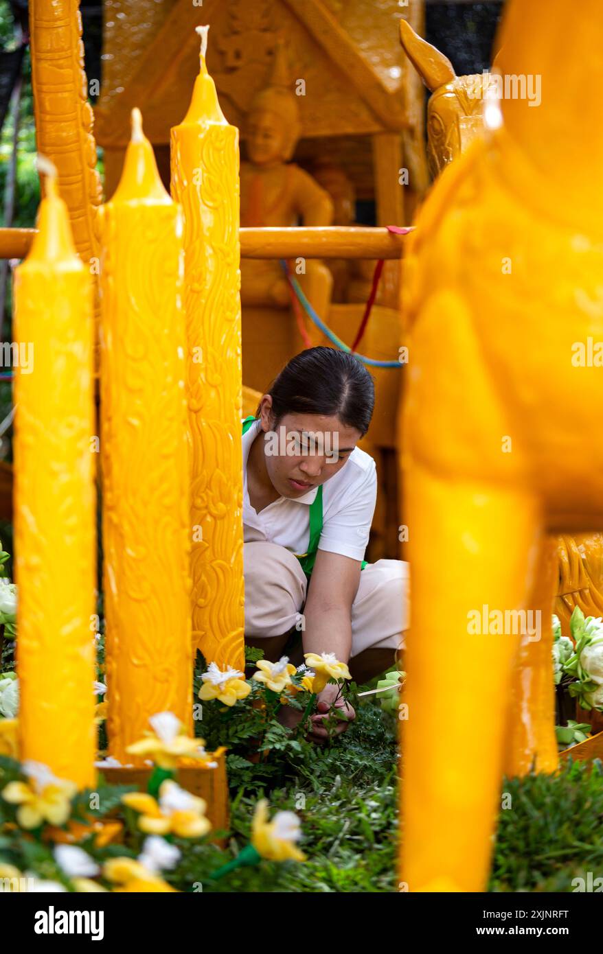 July 19, 2024, Ban Pa Tan, Lamphun, Thailand: A Thai villager decorates ...