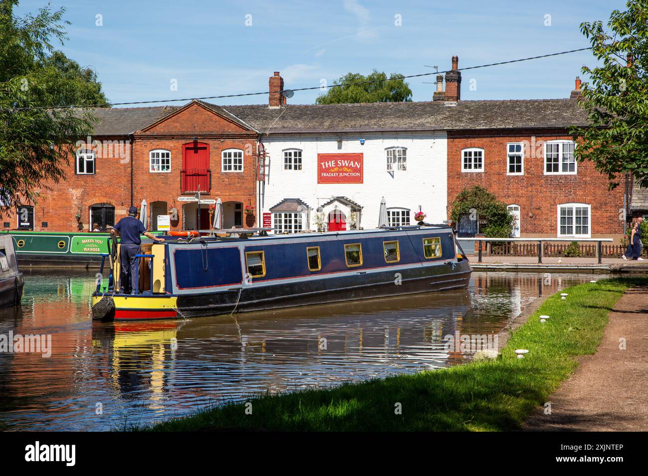 Canal narrowboat leaving the Coventry canal at Fradley Junction ...