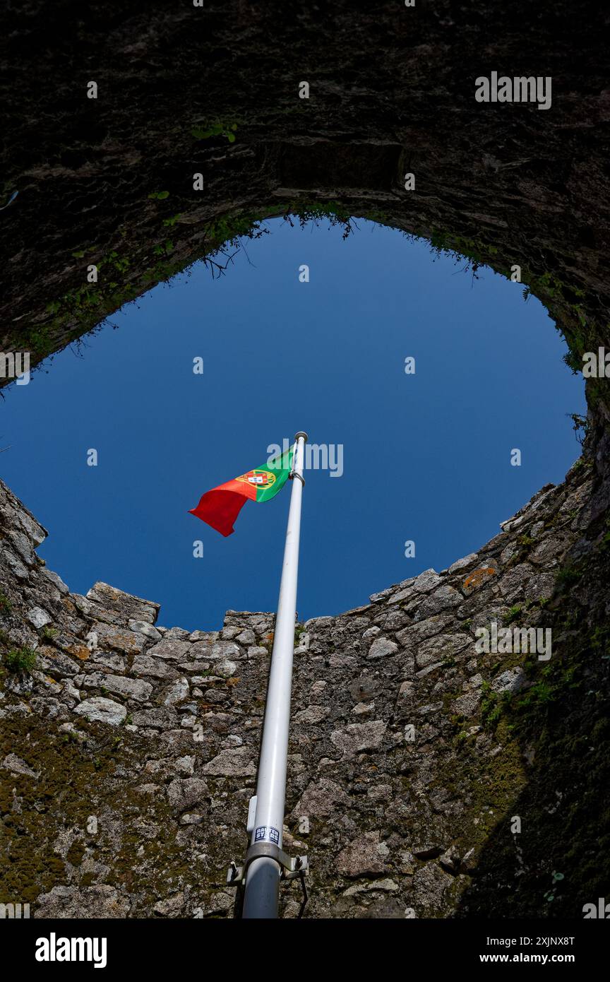 Portuguese flag waving atop a stone tower of the moorish castle in ...
