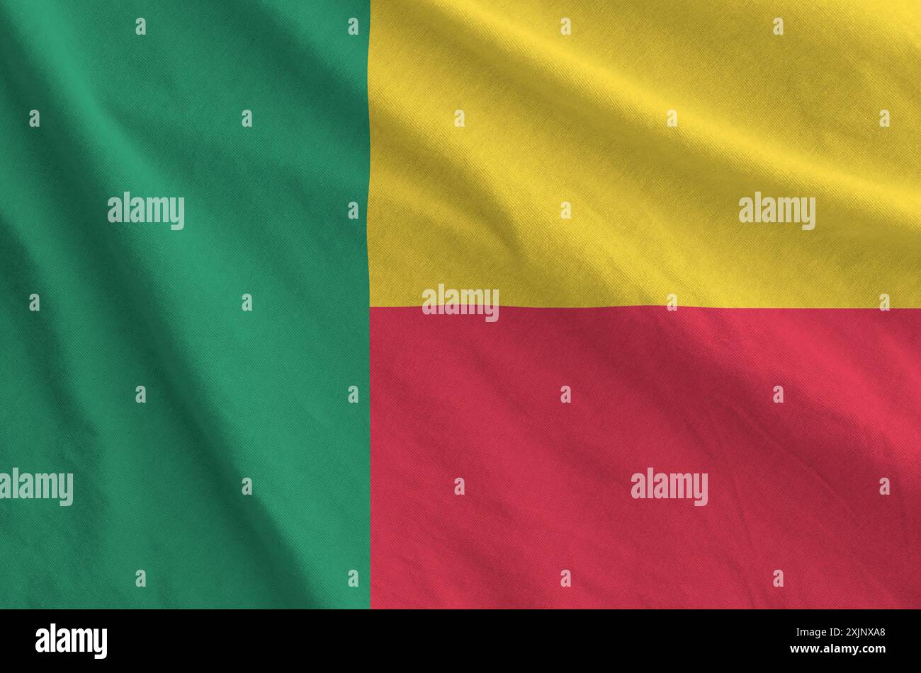 Benin flag depicted on folded wavy fabric of old cloth close up Stock ...