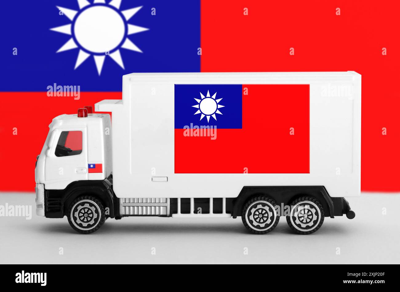 Taiwan flag depicted on side wall of white delivery van close up ...