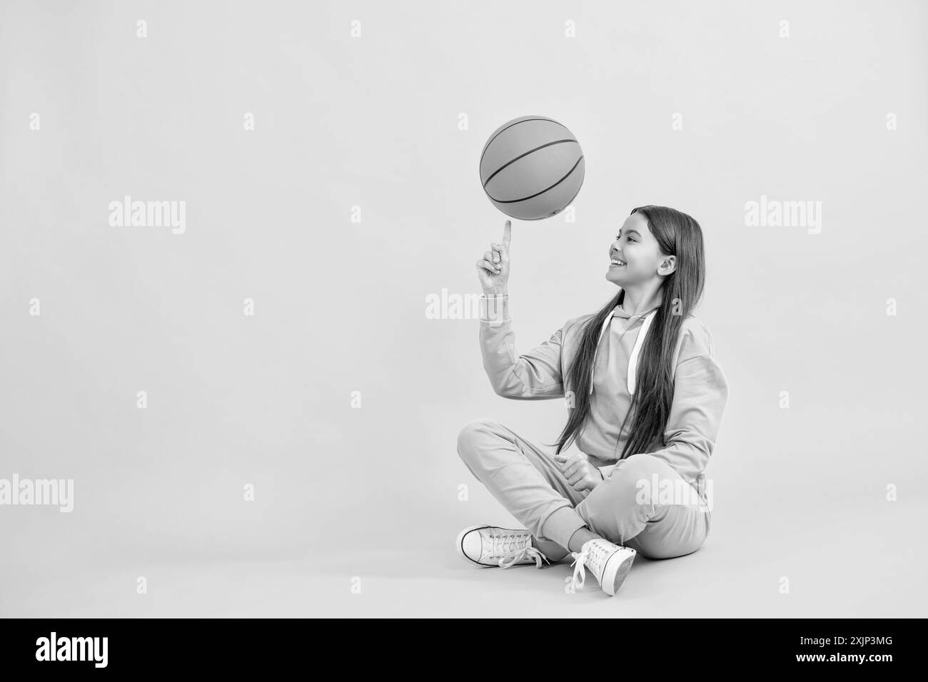 Teen girl excelling in basketball. Skilled teen girl playing the ...