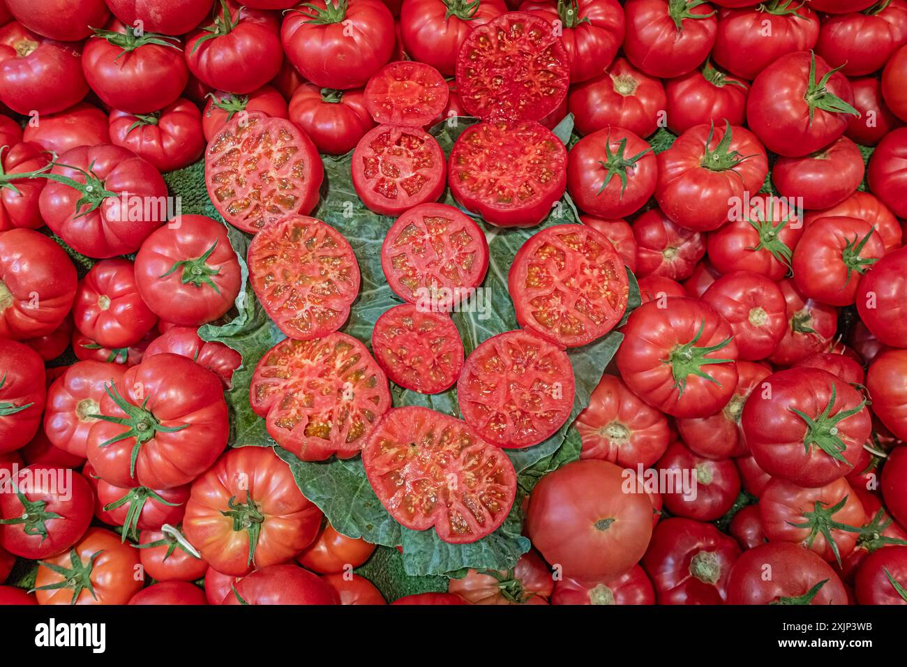 Fresh, organic, red tomatoes background. Top view of sliced tometo and ...