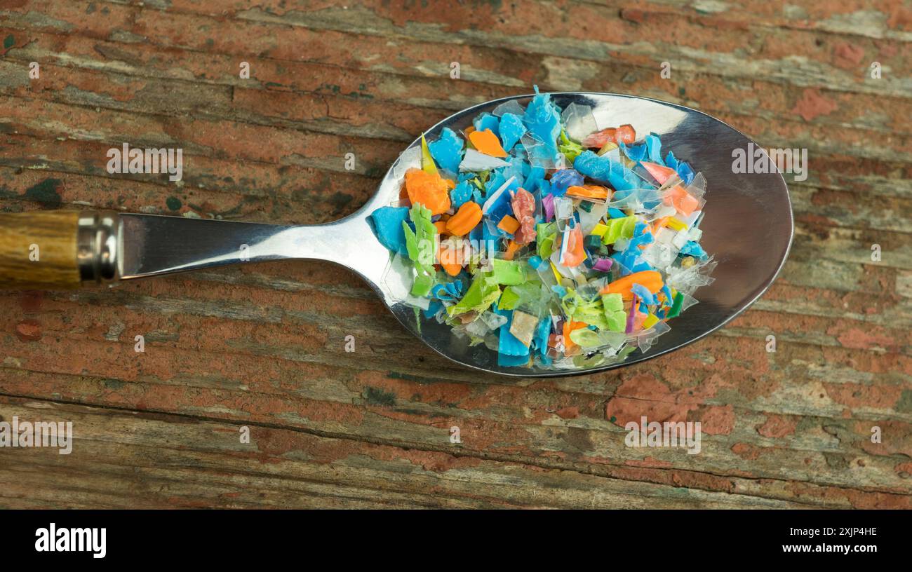 Microplastics in a spoon. A concept of consuming micro plastic ...