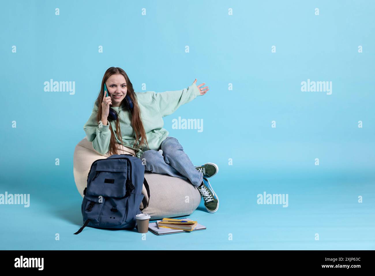 Happy girl receiving telephone call, saluting friends, using cellphone ...