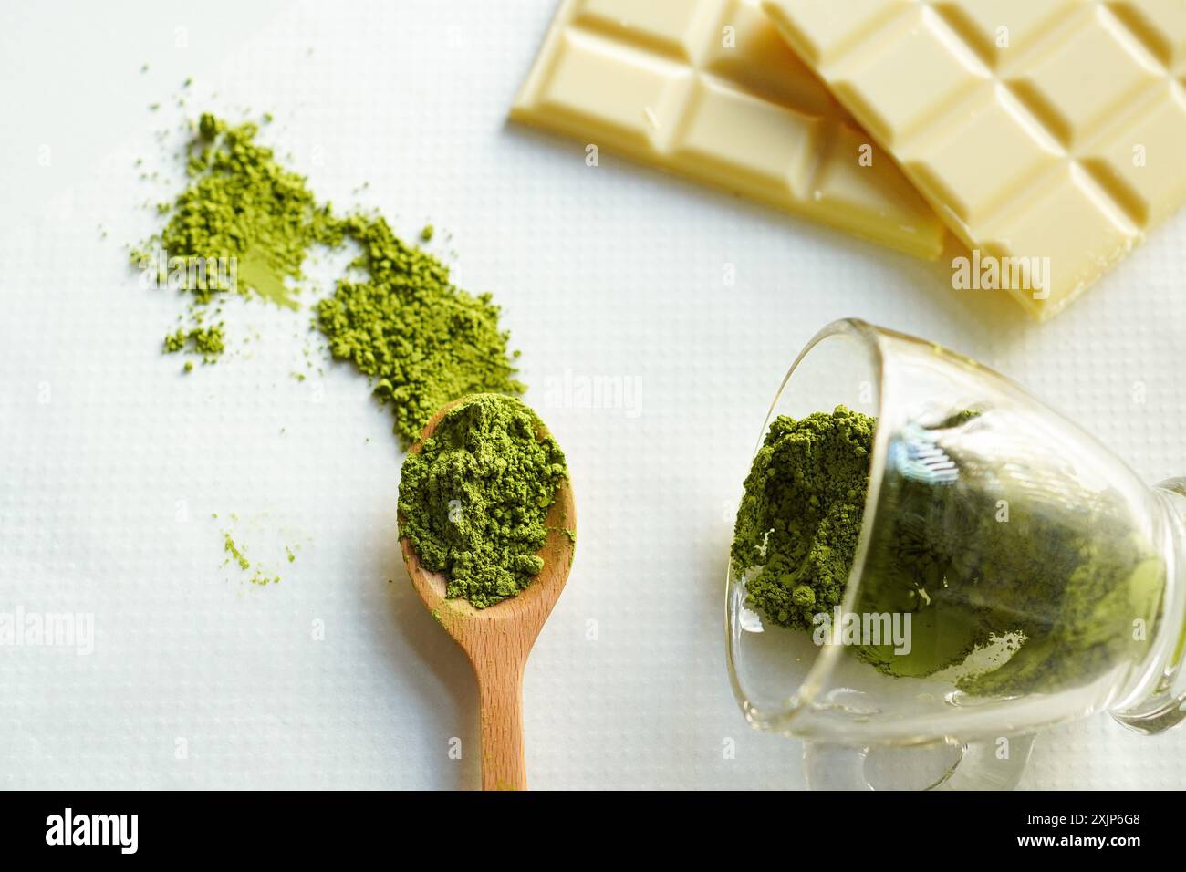 Organic matcha powder in wooden spoon with white background Stock Photo ...