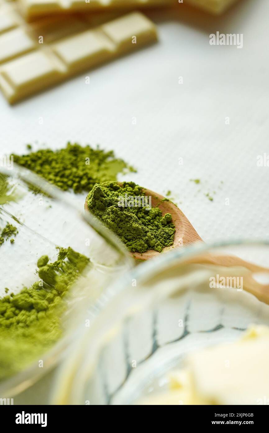 Organic matcha powder in wooden spoon with white background Stock Photo ...