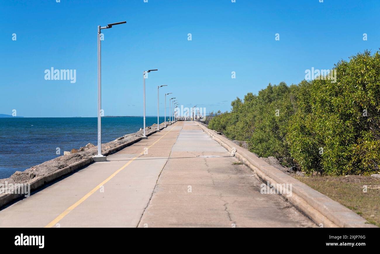 A concrete jetty built across the ocean to reach ship loading ...