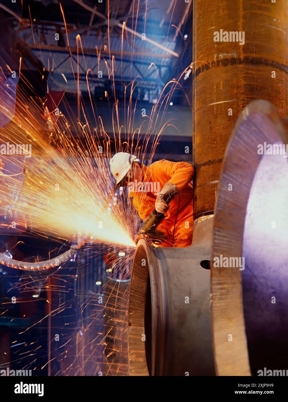 Skilled worker operates grinding tool hi-res stock photography and ...