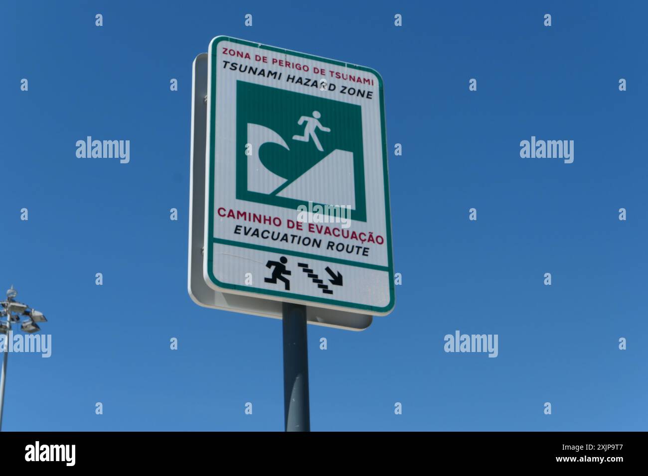 Tsunami hazard zone sign. Sign announcing a risk of tsunami and ...
