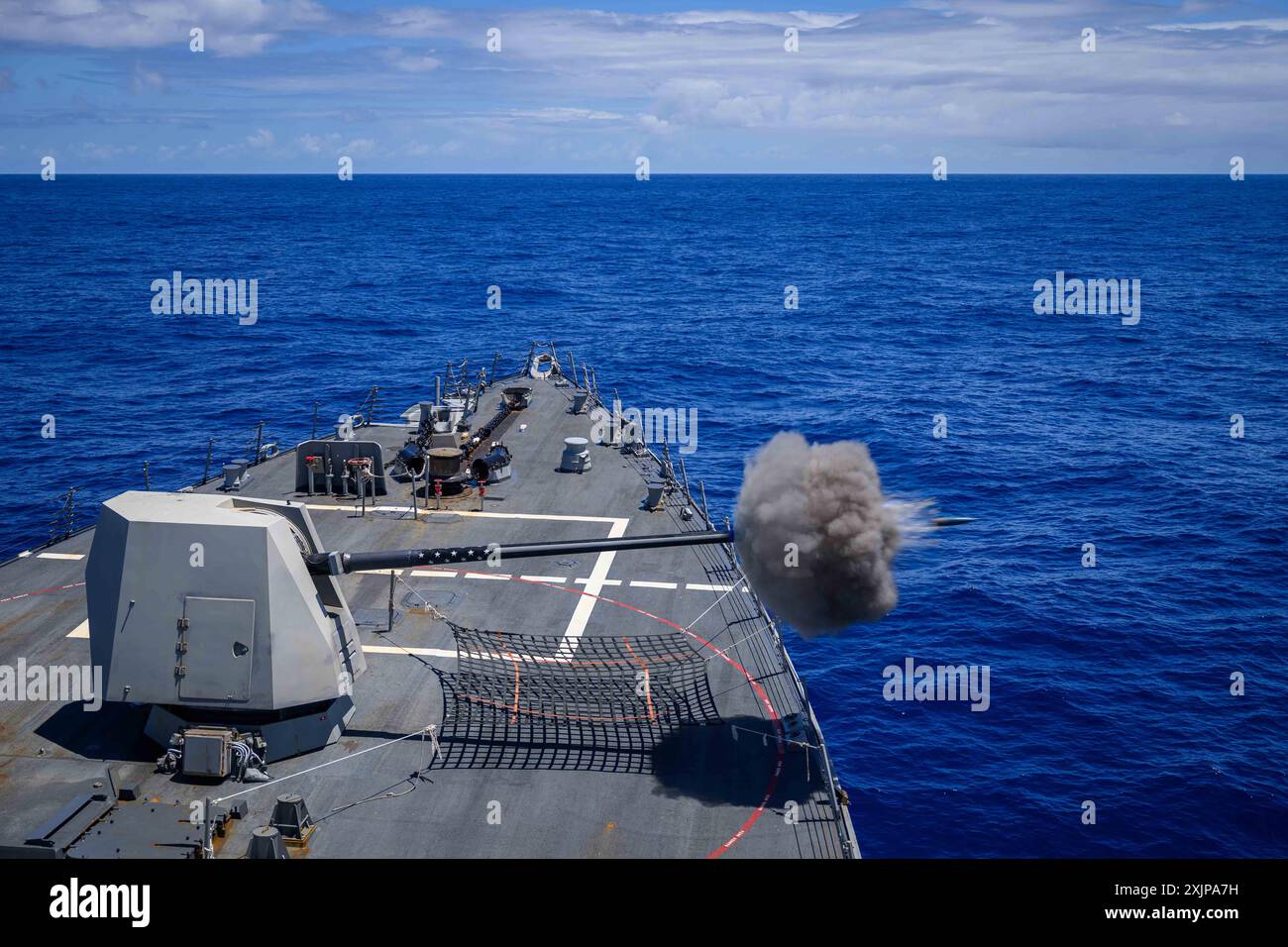A Mark 45 5-inch gun fires aboard the Arleigh Burke-class guided ...