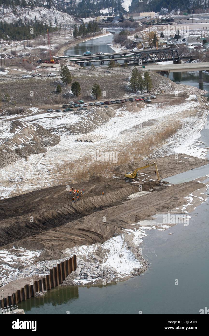 Backhoe breaches coffer dam and water starts draining. The clean fill ...