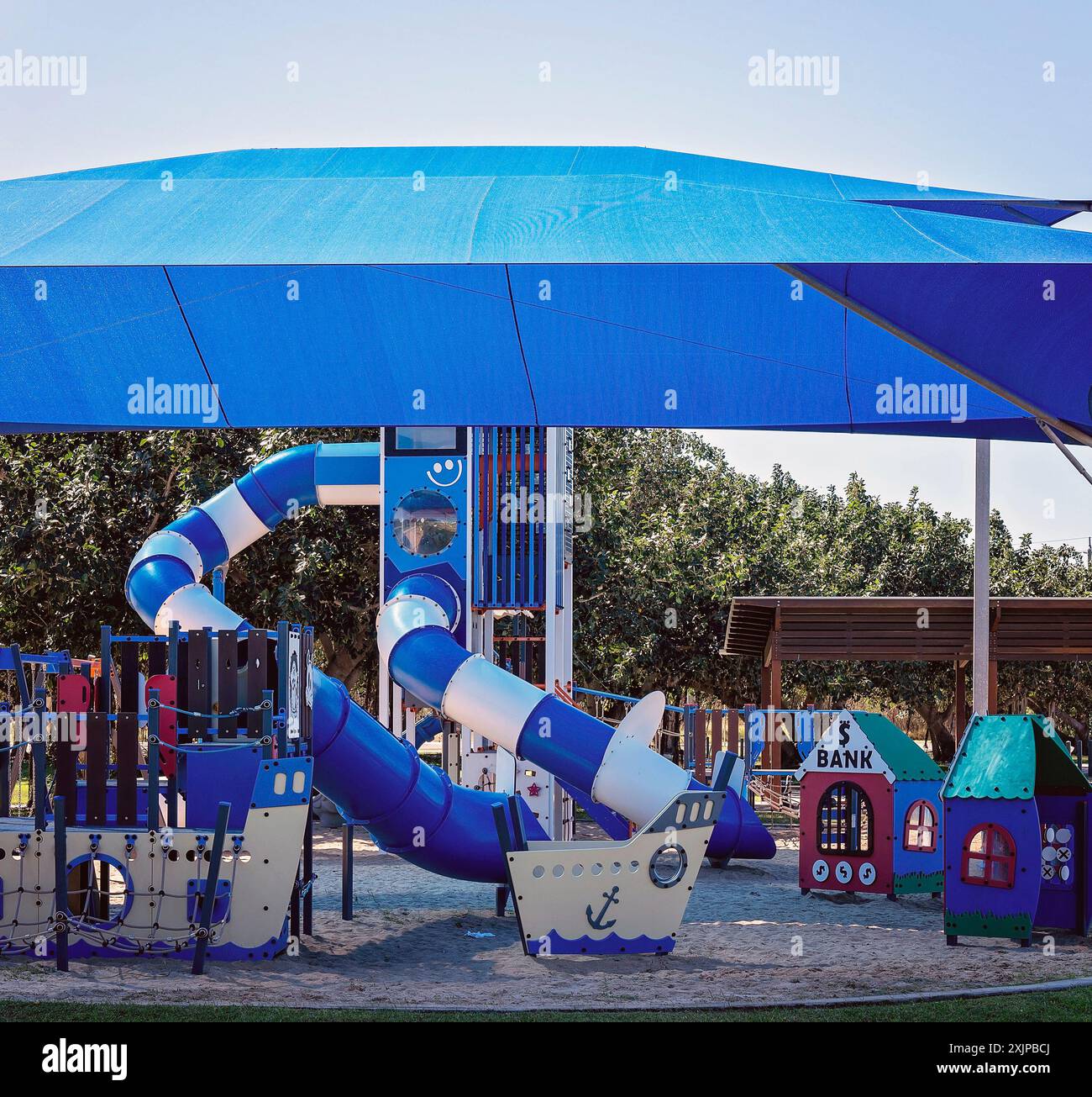 Playground equipment in a public park for children to play under the ...