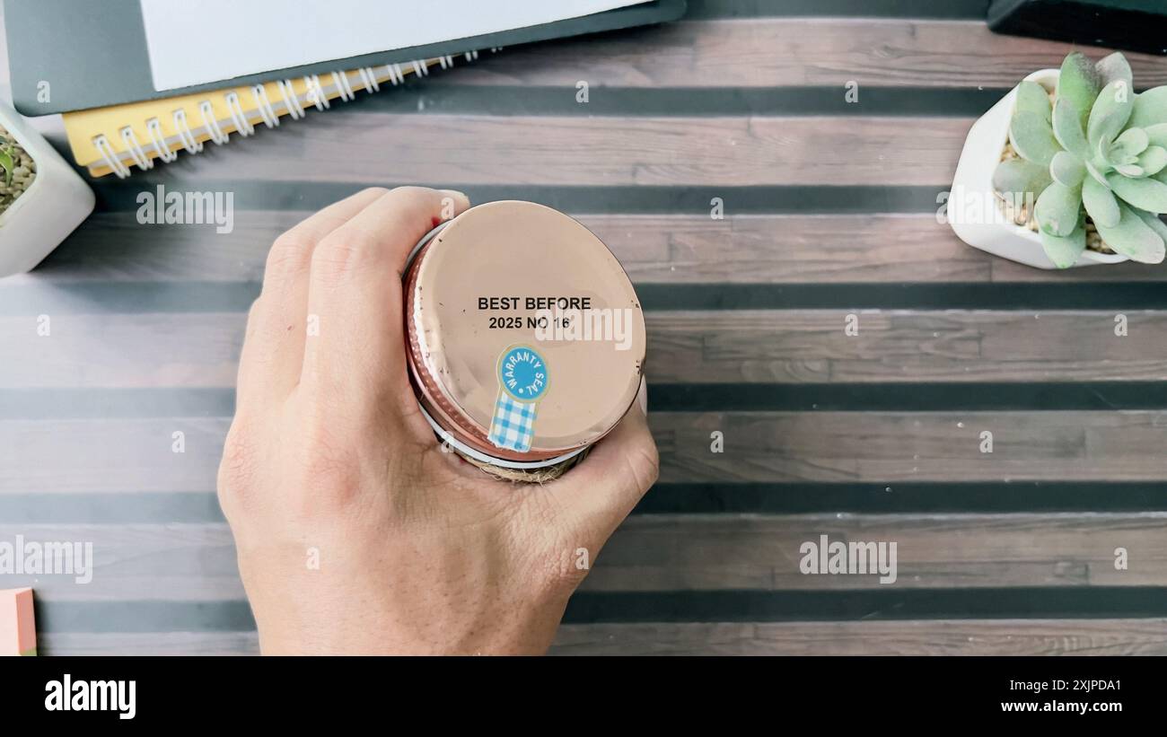 Close up text best before date on bottle cap food Stock Photo - Alamy