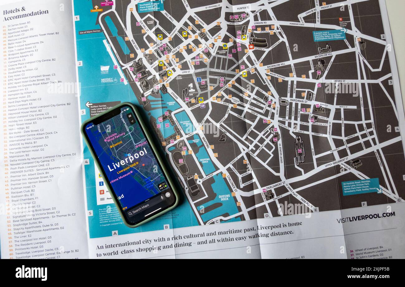 Liverpool paper tourist map and iPhone map Stock Photo - Alamy