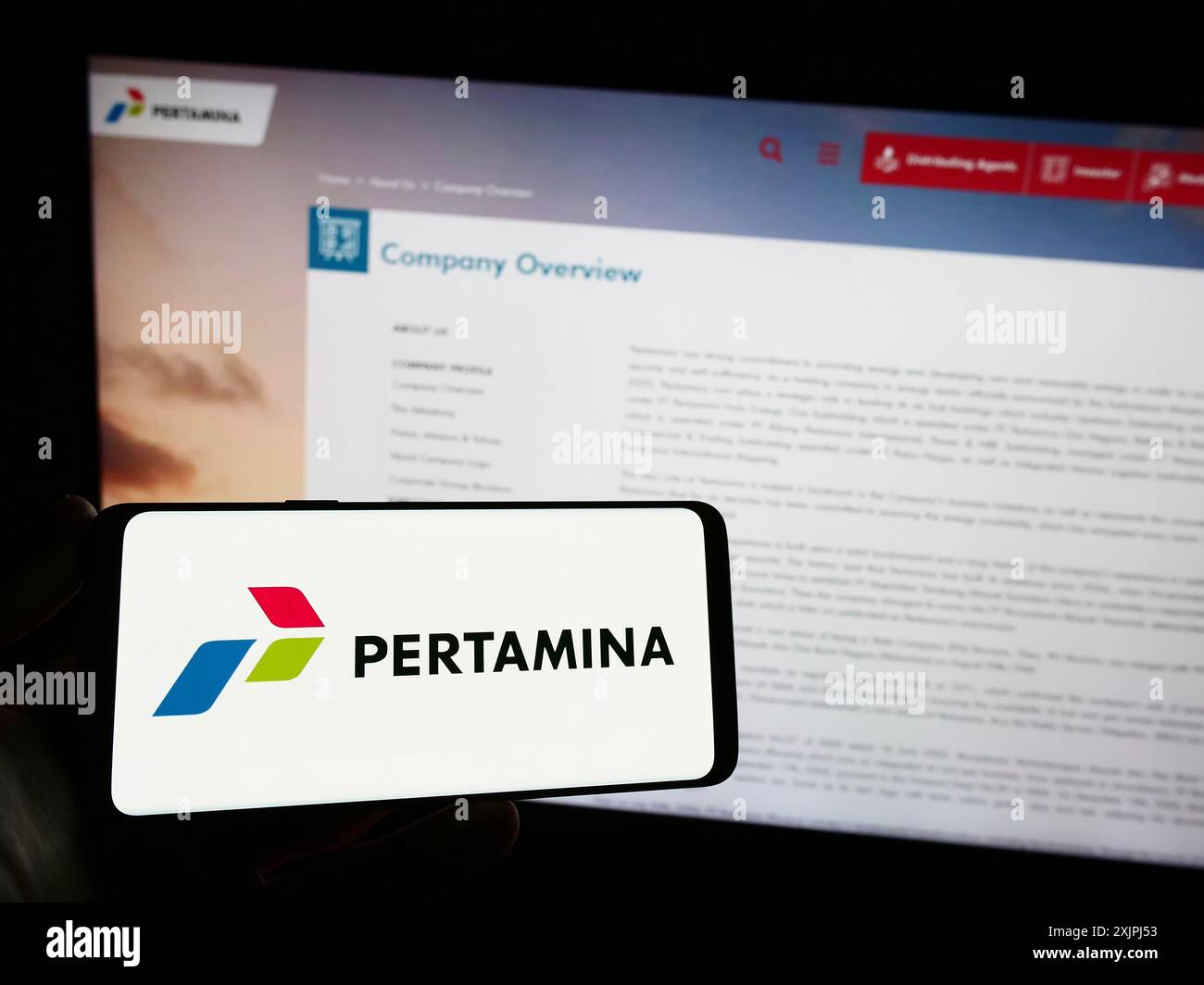 Stuttgart, Germany, 06-30-2023: Person holding smartphone with logo of Indonesian company PT ...