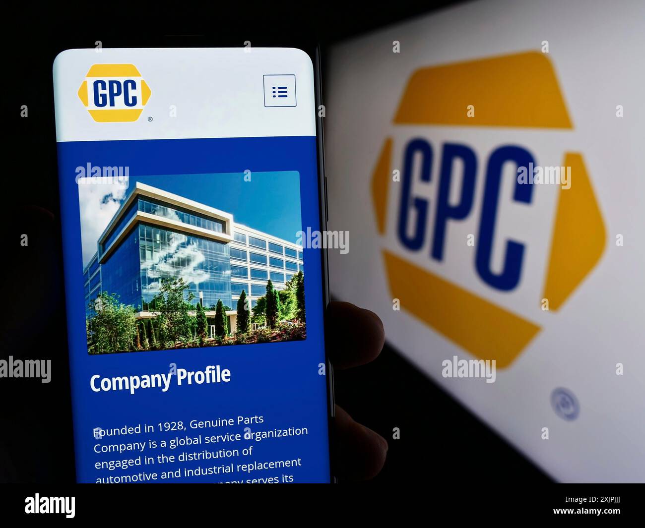 Stuttgart, Germany, 07-01-2023: Person holding mobile phone with webpage of US business Genuine ...