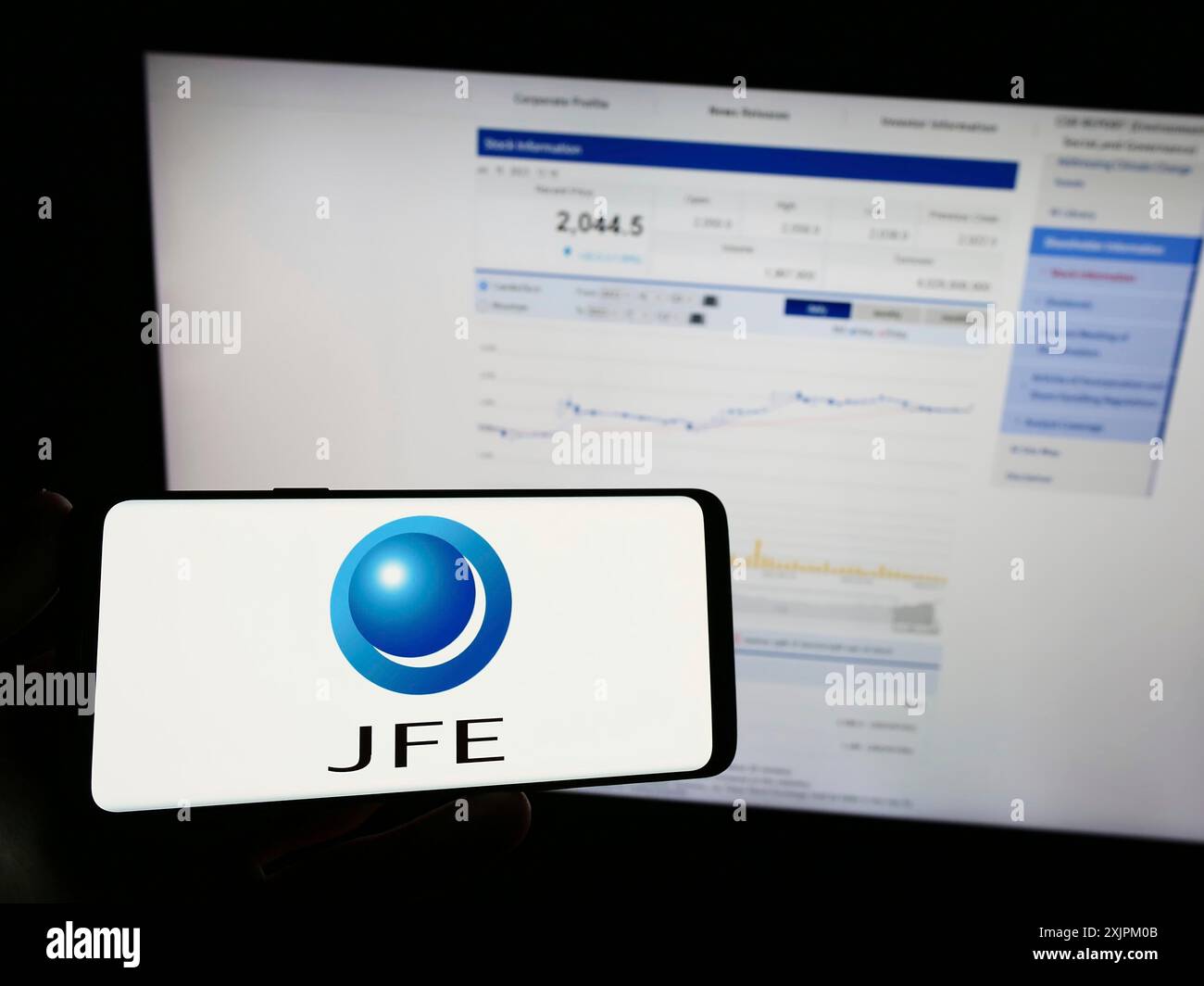 Stuttgart, Germany, 07-19-2023: Person holding smartphone with logo of Japanese steel company ...