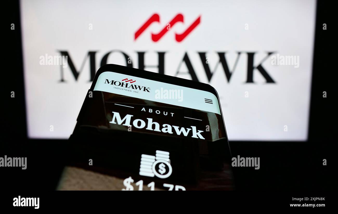 Stuttgart, Germany, 08-05-2023: Mobile phone with website of US flooring company Mohawk ...