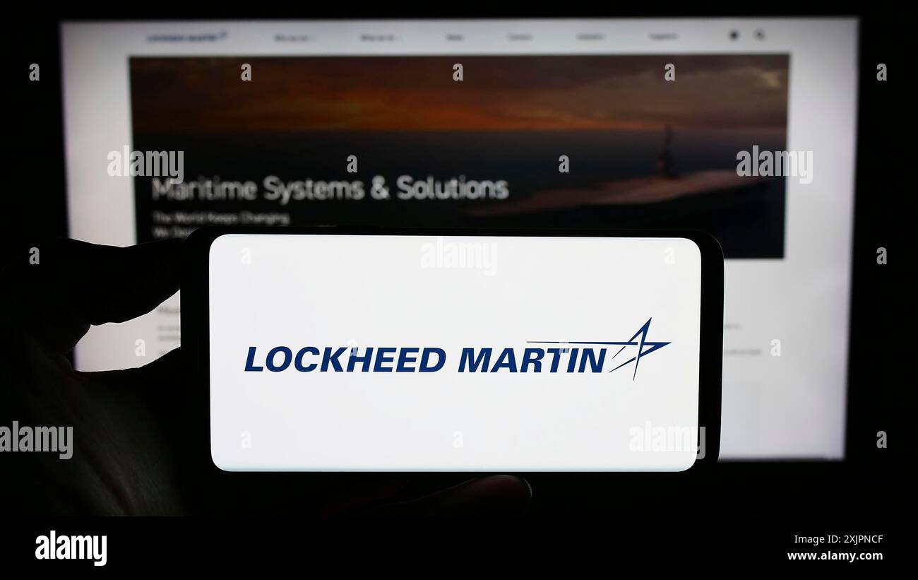 Stuttgart, Germany, 08-02-2023: Person holding cellphone with logo of ...