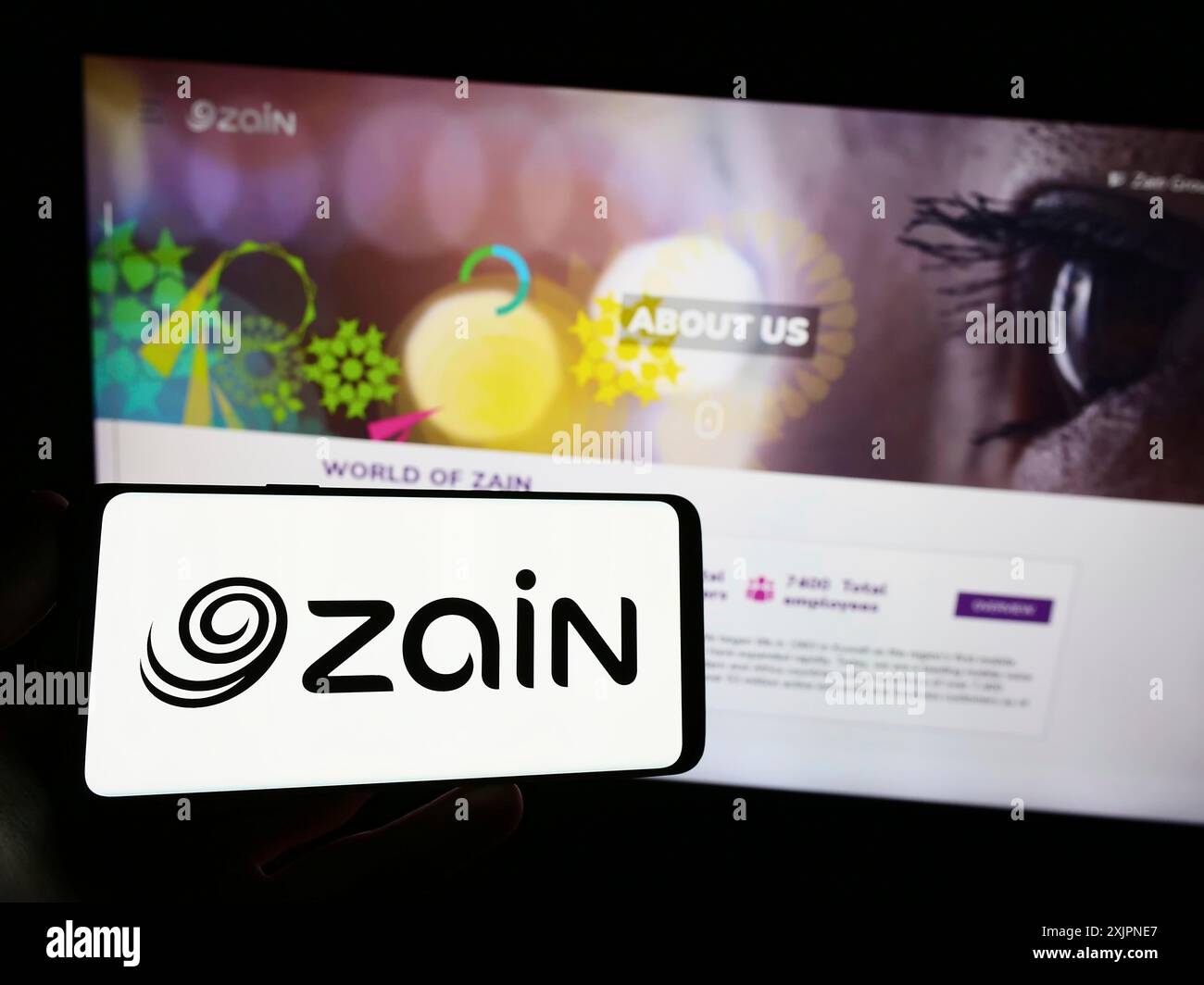 Stuttgart, Germany, 08-05-2023: Person holding smartphone with logo of Mobile Telecommunications ...