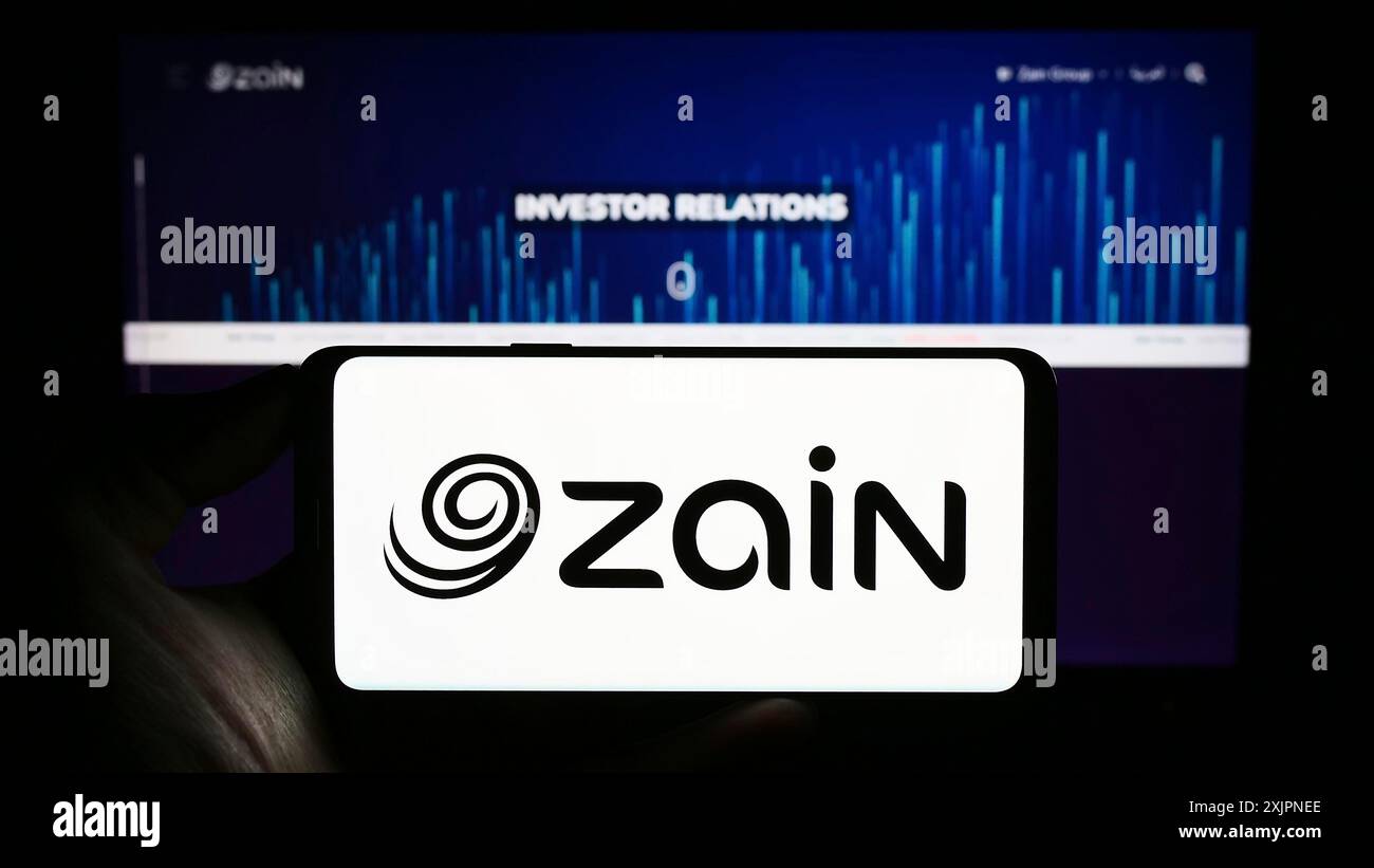 Stuttgart, Germany, 08-05-2023: Person holding cellphone with logo of Mobile Telecommunications ...