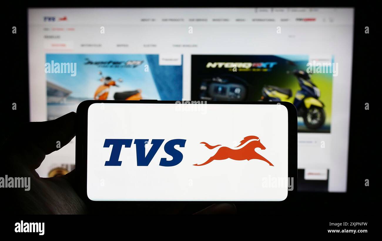 Stuttgart, Germany, 08-05-2023: Person holding mobile phone with logo ...