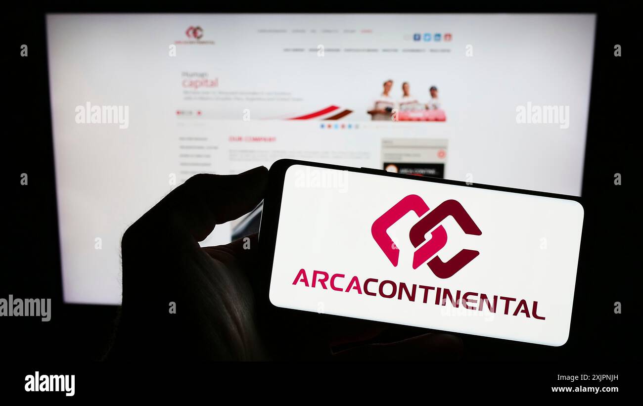 Stuttgart, Germany, 08-05-2023: Person holding mobile phone with logo ...