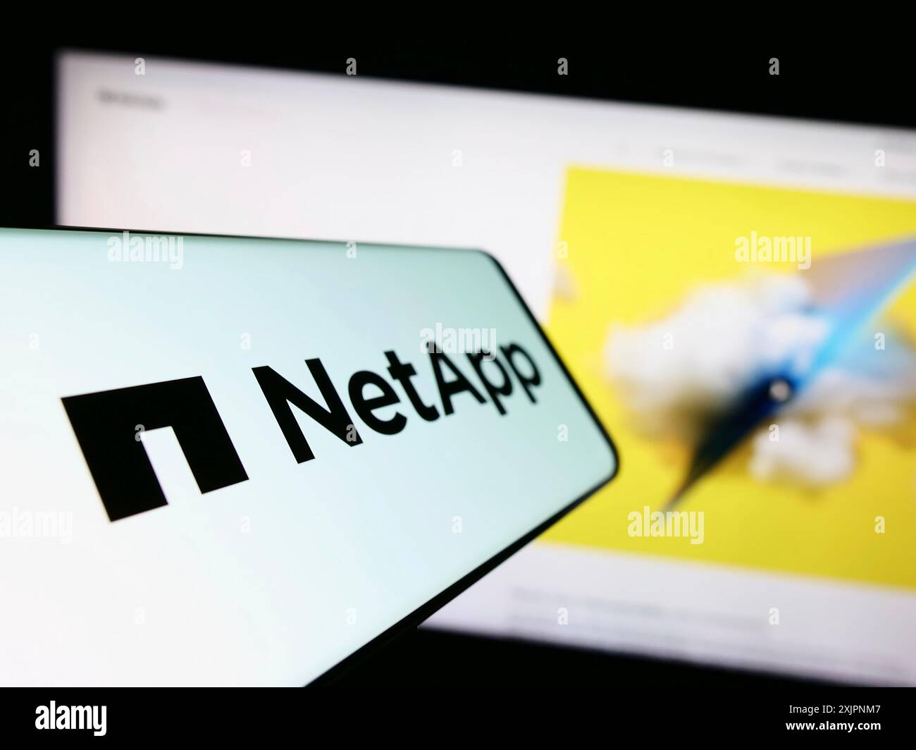Stuttgart, Germany, 08-06-2023: Mobile phone with logo of American cloud company NetApp Inc. on ...