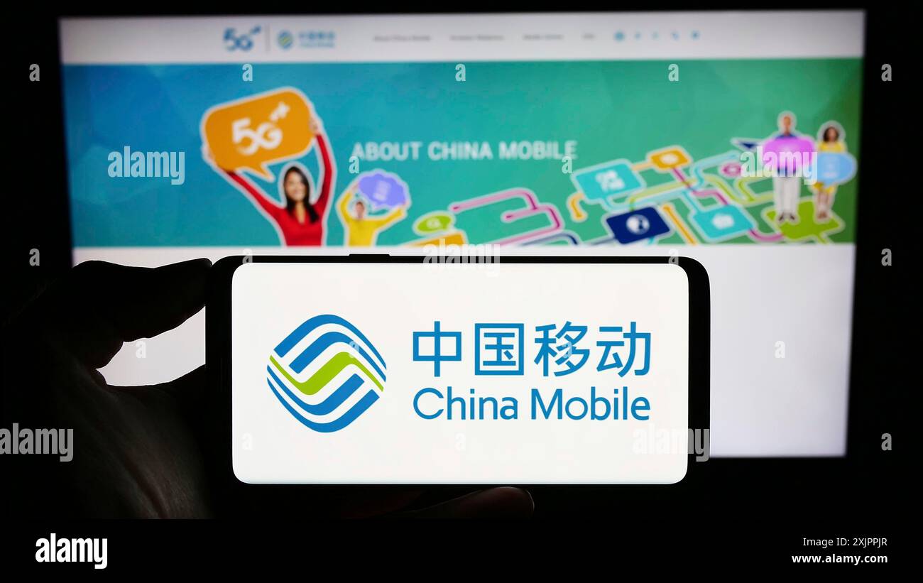 Stuttgart, Germany, 08-14-2023: Person holding mobile phone with logo ...