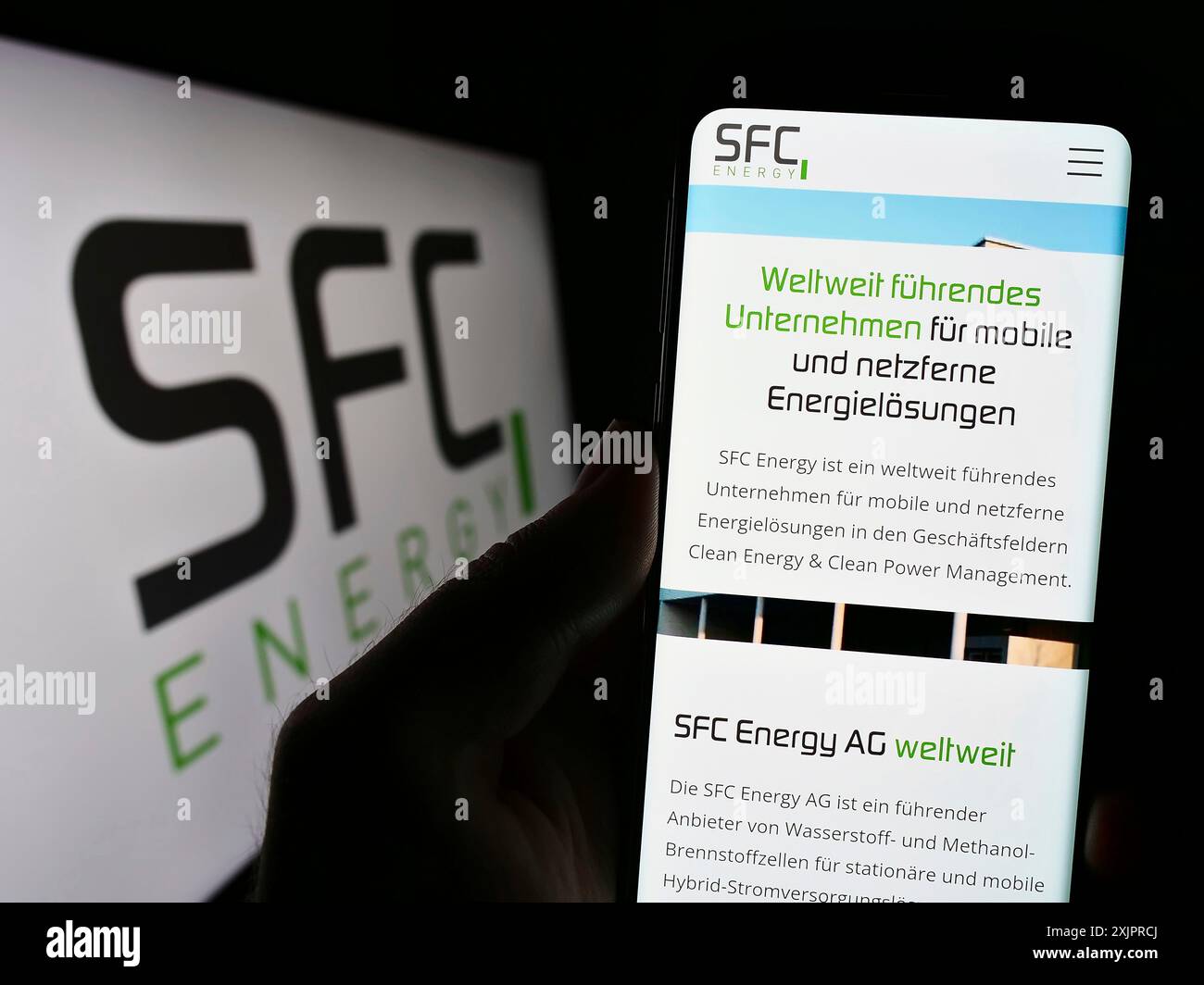 Stuttgart, Germany, 08-22-2023: Person holding cellphone with webpage ...