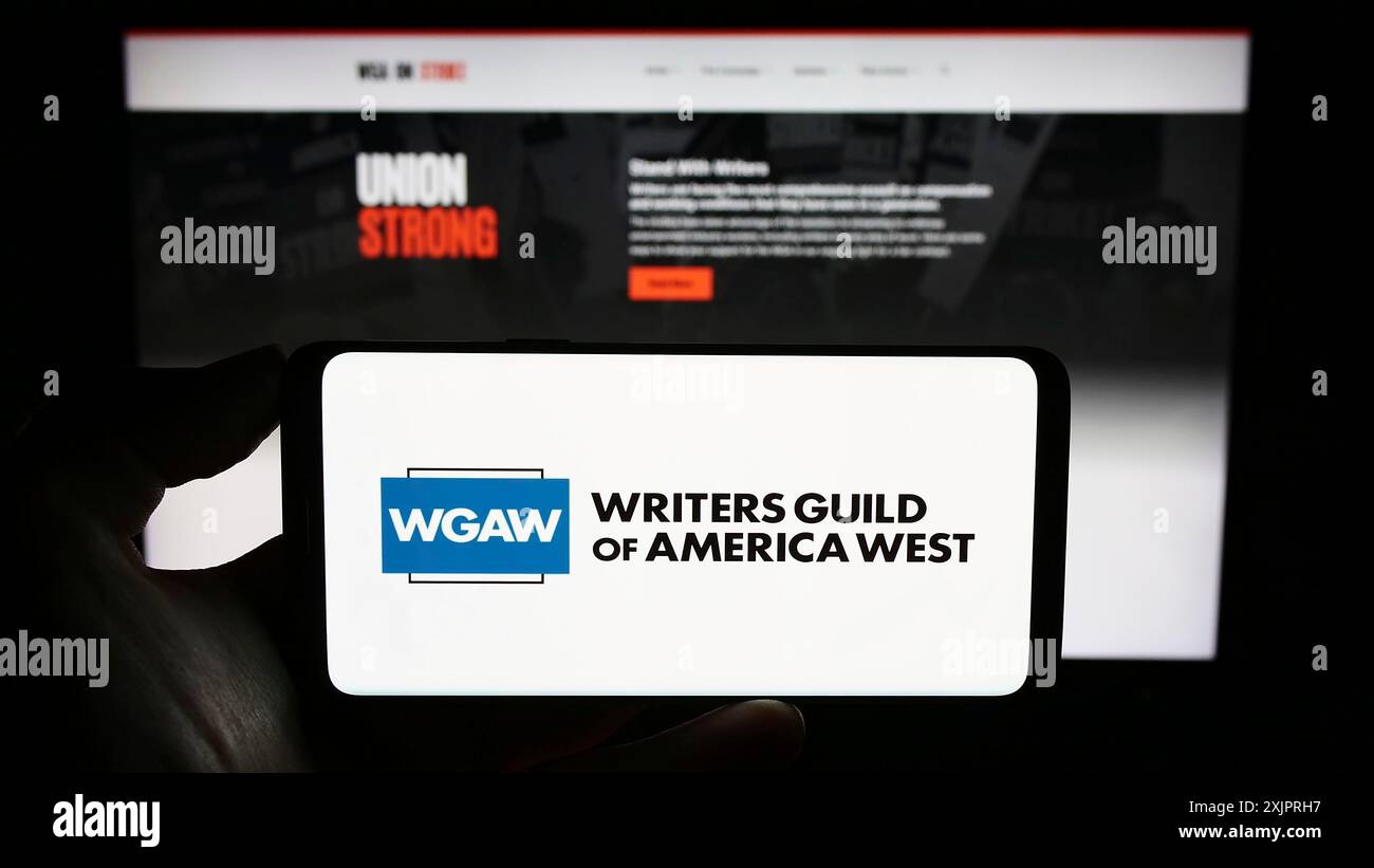 Stuttgart, Germany, 08-26-2023: Person holding mobile phone with logo ...