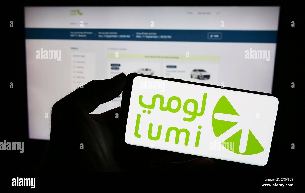 Stuttgart, Germany, 09-02-2023: Person holding mobile phone with logo ...