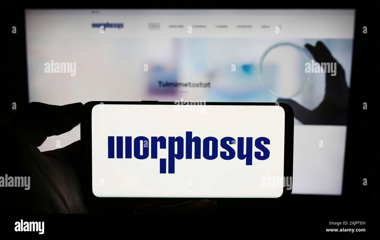 Stuttgart, Germany, 09-10-2023: Person holding smartphone with logo of ...