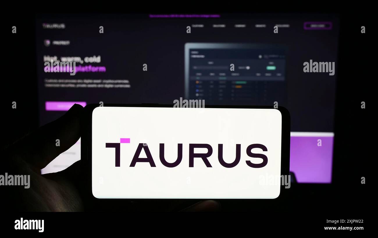 Stuttgart, Germany, 09-18-2023: Person holding smartphone with logo of Swiss digital assets ...