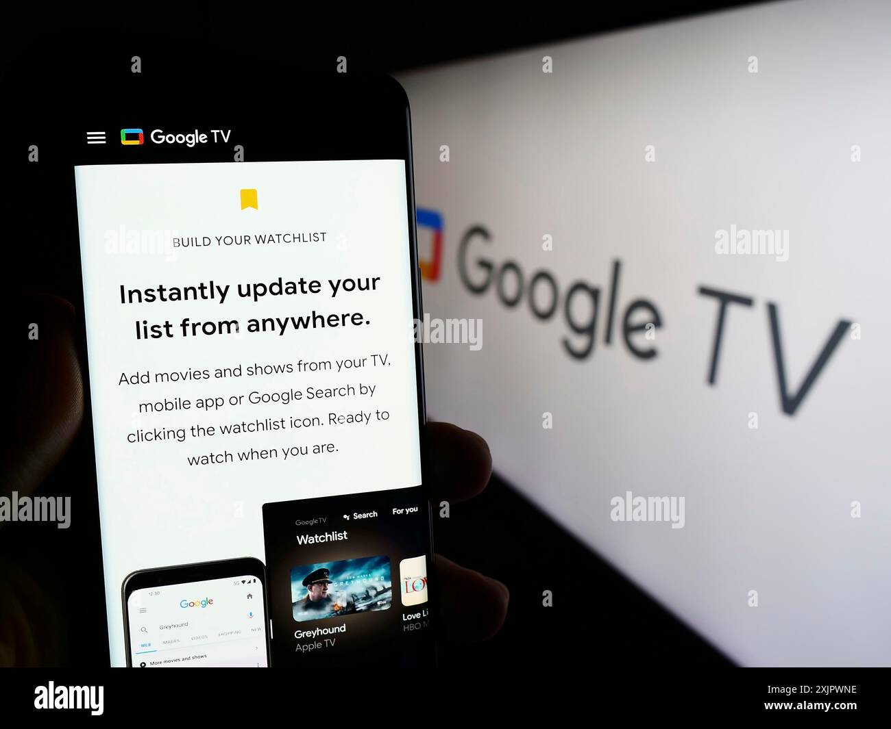 Stuttgart, Germany, 09-23-2023: Person holding smartphone with web page of video on demand ...