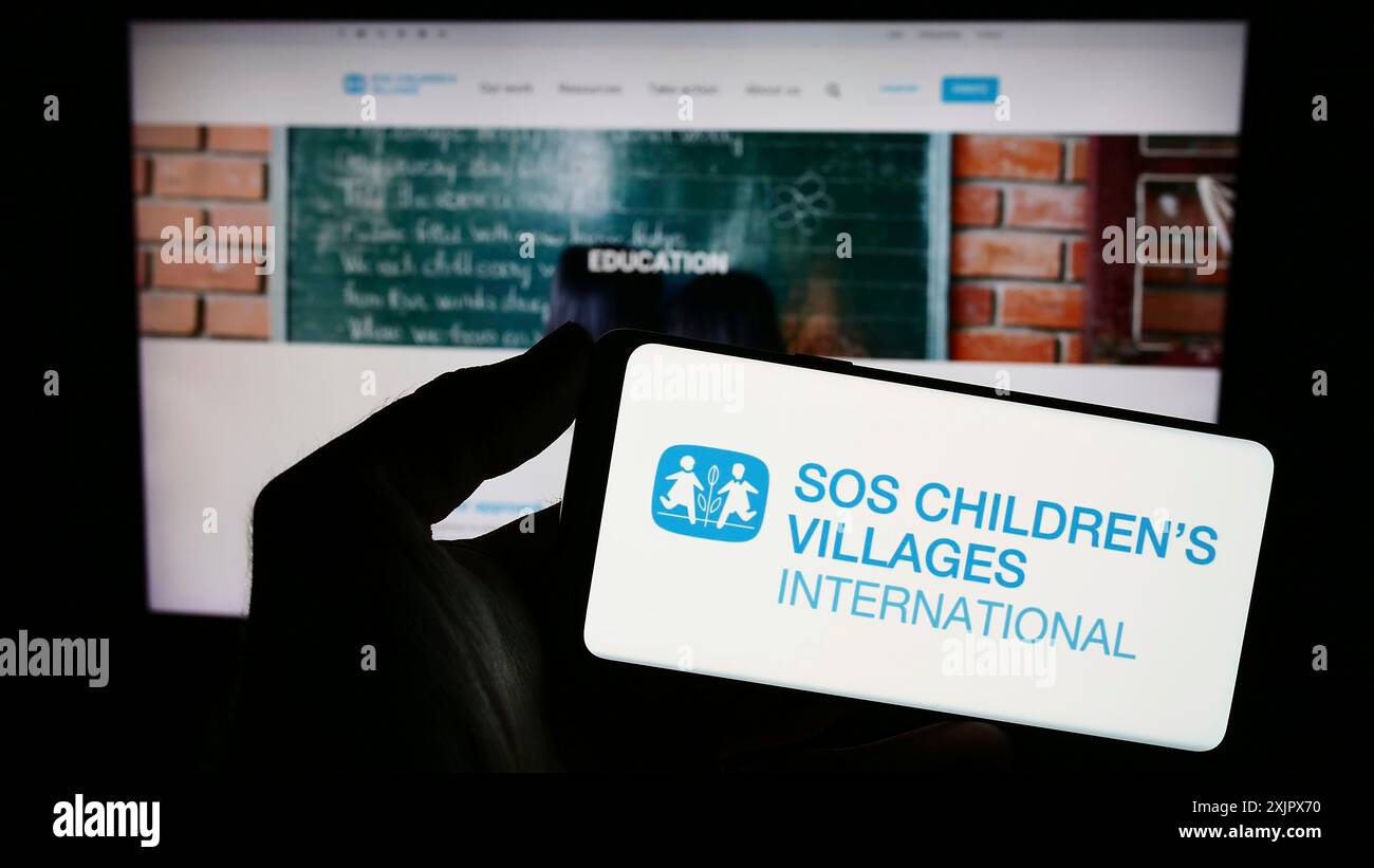 Stuttgart, Germany, 10-06-2023: Person holding smartphone with logo of ...