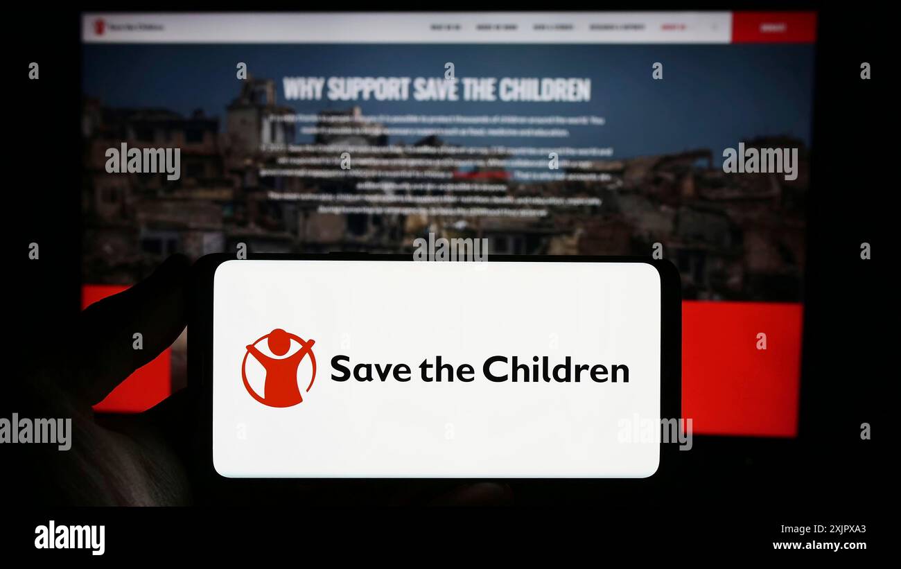 Stuttgart, Germany, 10-06-2023: Person holding smartphone with logo of ...