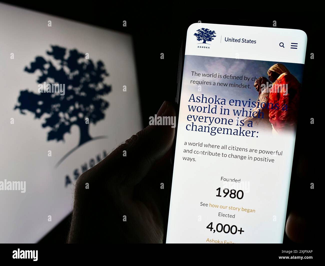 Stuttgart, Germany, 10-09-2023: Person holding cellphone with webpage of social entrepreneurship ...